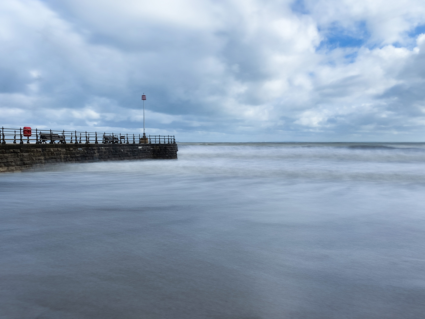 Long Exposure of Waves breaking over the Jetty | Swanage gallery